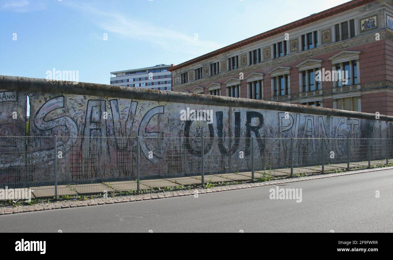 Save our planet graffiti, Berlin Wall Stock Photo - Alamy