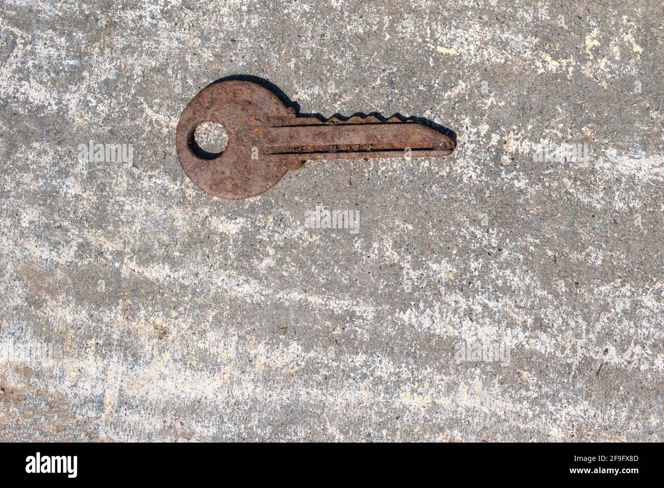 One old rusty key on a gray background. Stay at home concept. Abandoned ...