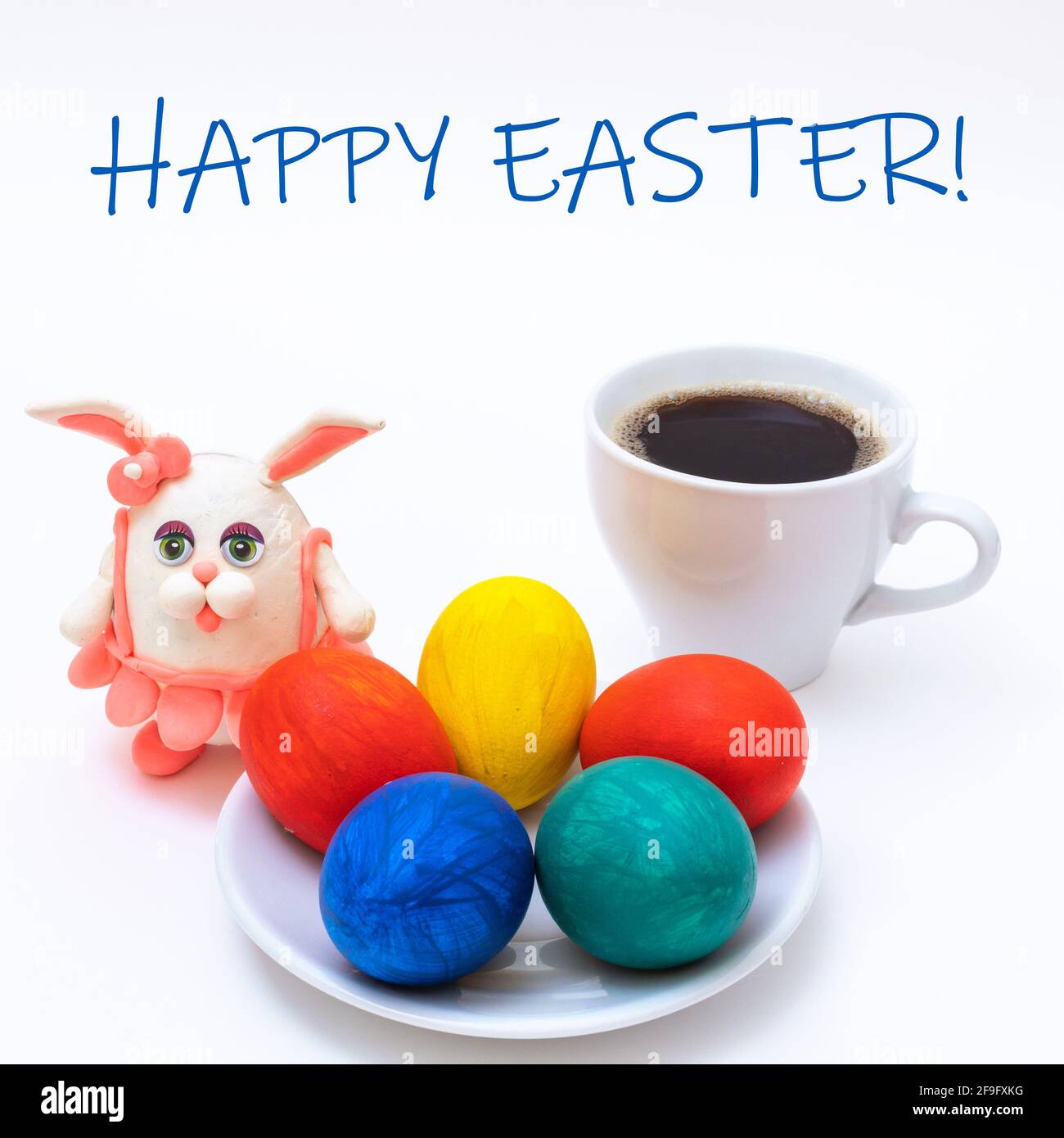 Easter breakfast concept. Hand-painted Easter eggs, a mug of coffee or ...