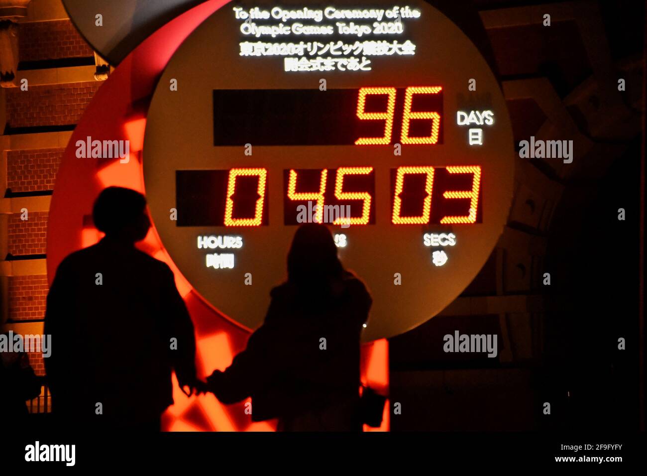 Hachioji, Japan. 18th Apr, 2021. Pedestrian take a photo big countdown ...