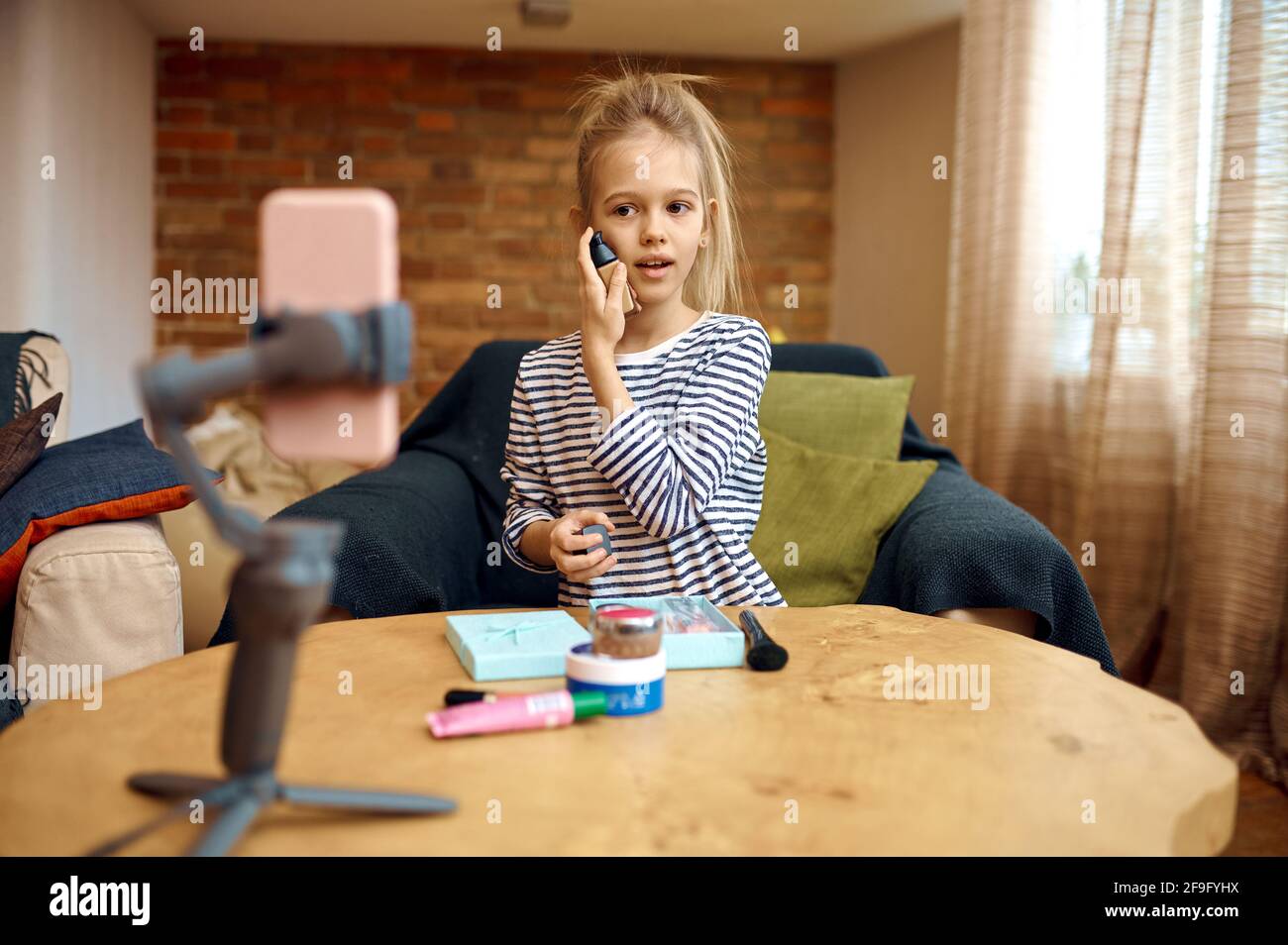 Female child records blog, little blogger Stock Photo - Alamy