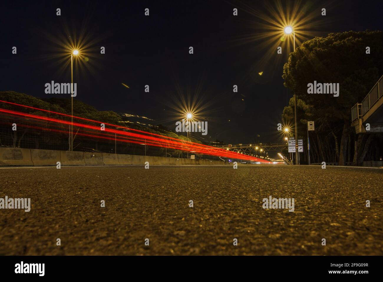 A road surrounded by lights with long exposure at night - great for ...
