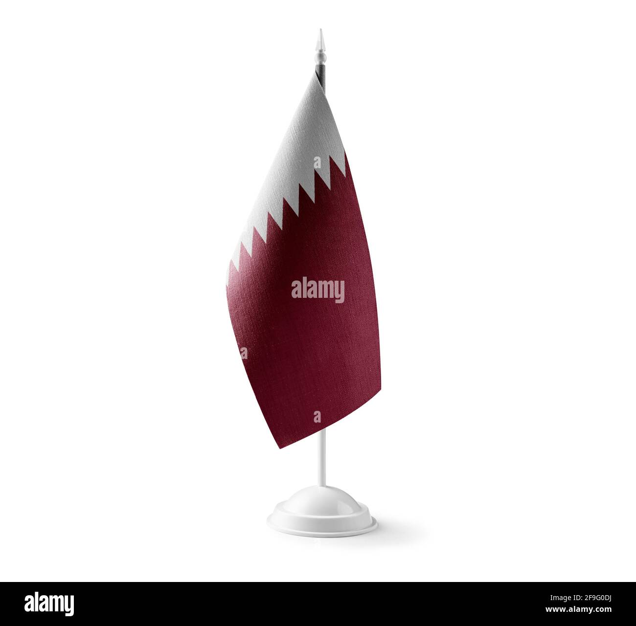 Small national flag of the Qatar on a white background Stock Photo - Alamy