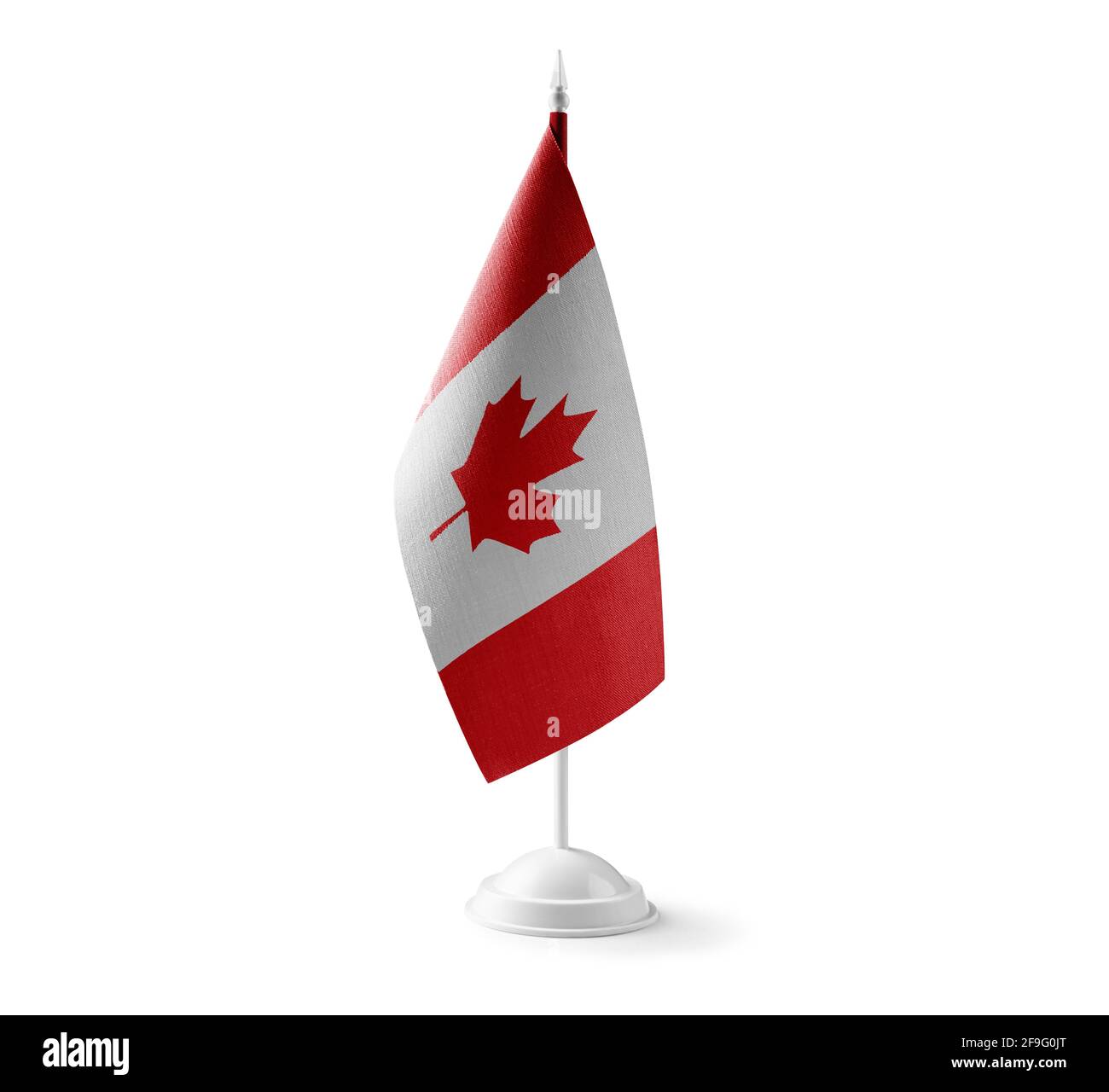 Small national flag of the Canada on a white background Stock Photo - Alamy