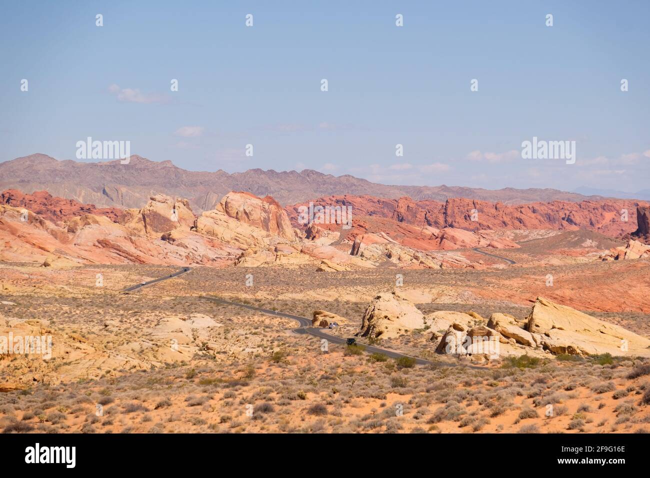 Curving Highway Extends Into Horizon Onto Red Aztec Sandstone Mountain ...