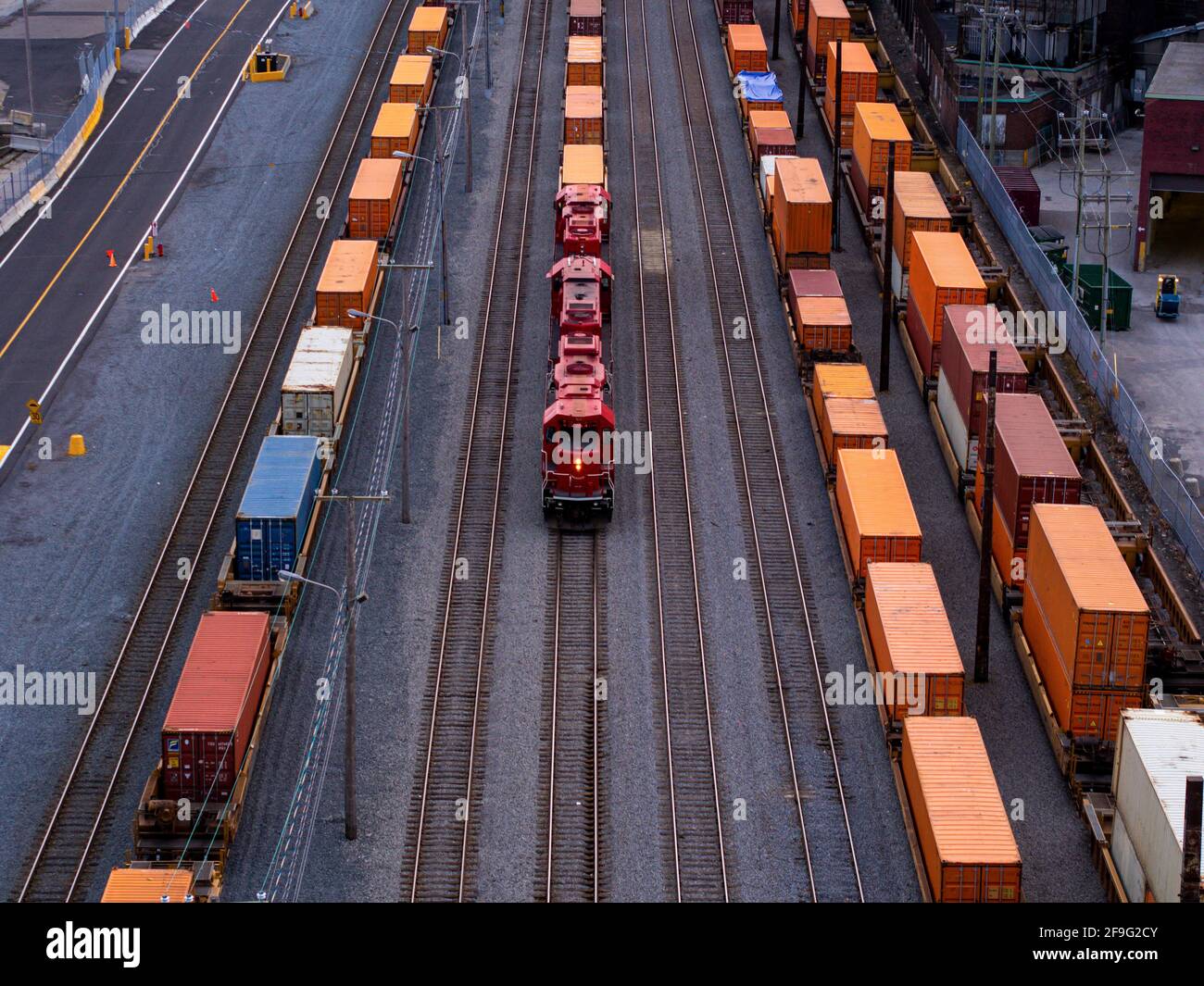 freight train in summer with lots of orange cars Stock Photo - Alamy