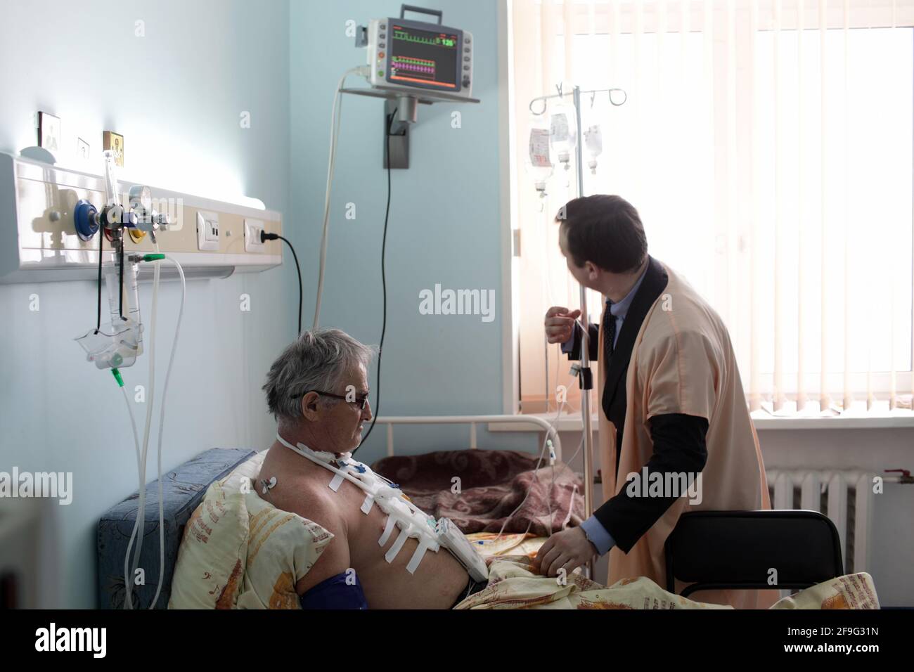Nurse boy and patient in a hospital ward Stock Photo - Alamy