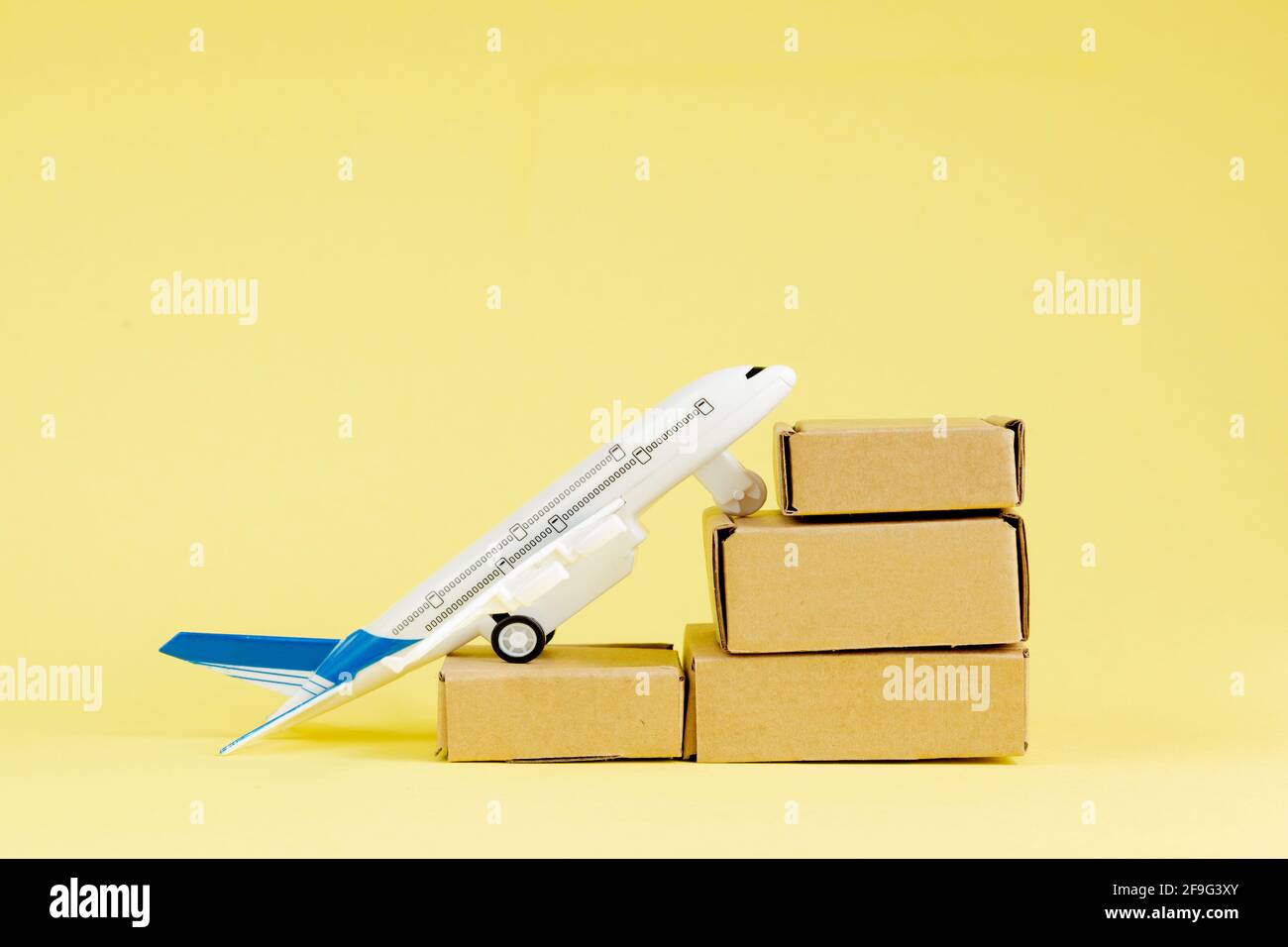 Airplane and stack of cardboard boxes. concept of air cargo and parcels ...