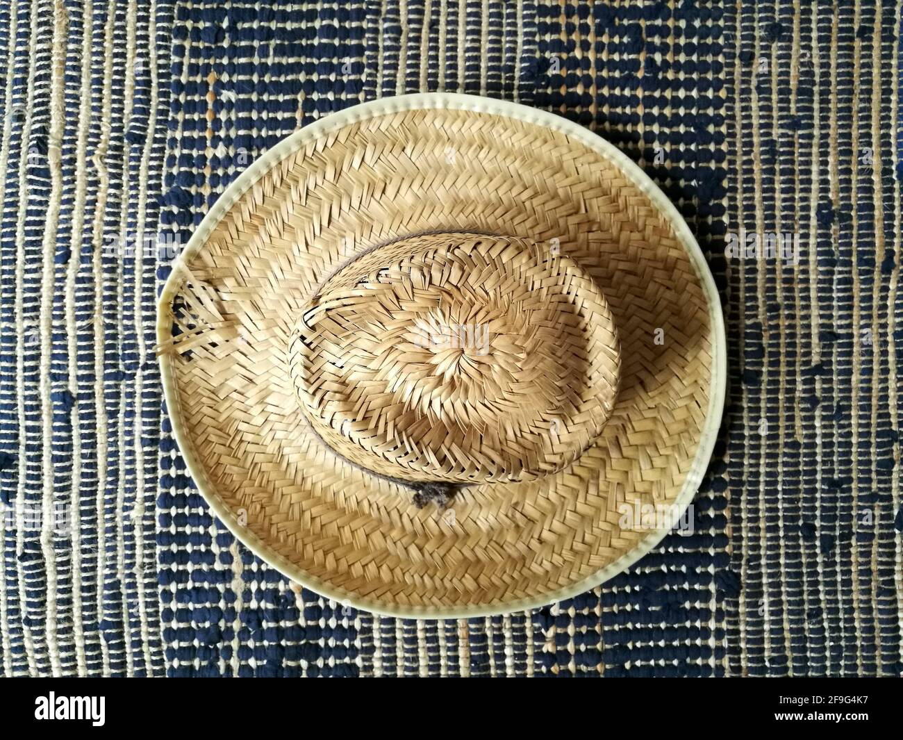 A top view of a farmers hat on a patterned surface Stock Photo - Alamy