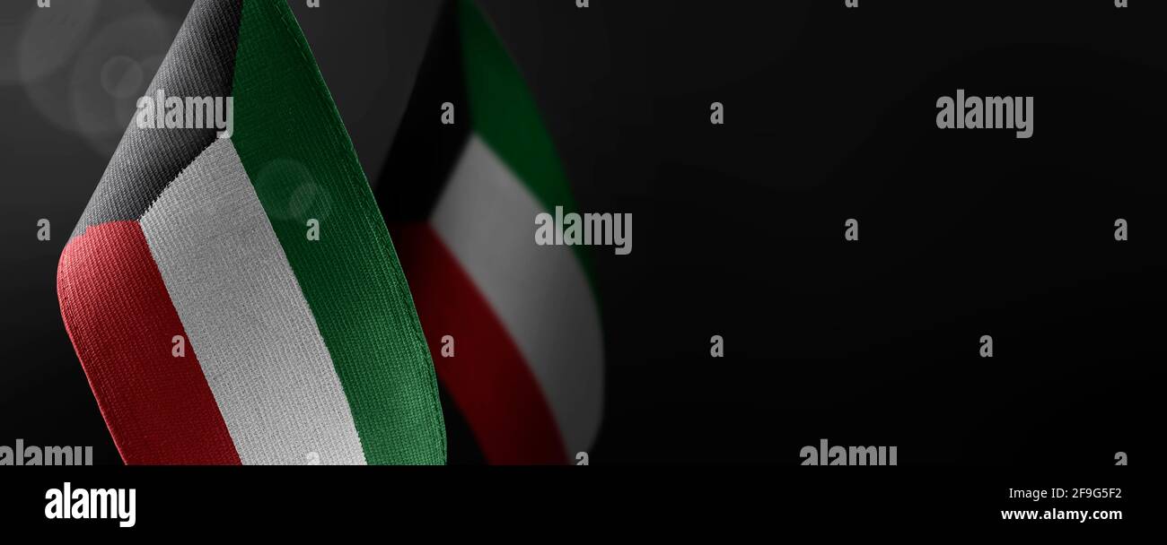 Small national flags of the Kuwait on a dark background Stock Photo - Alamy