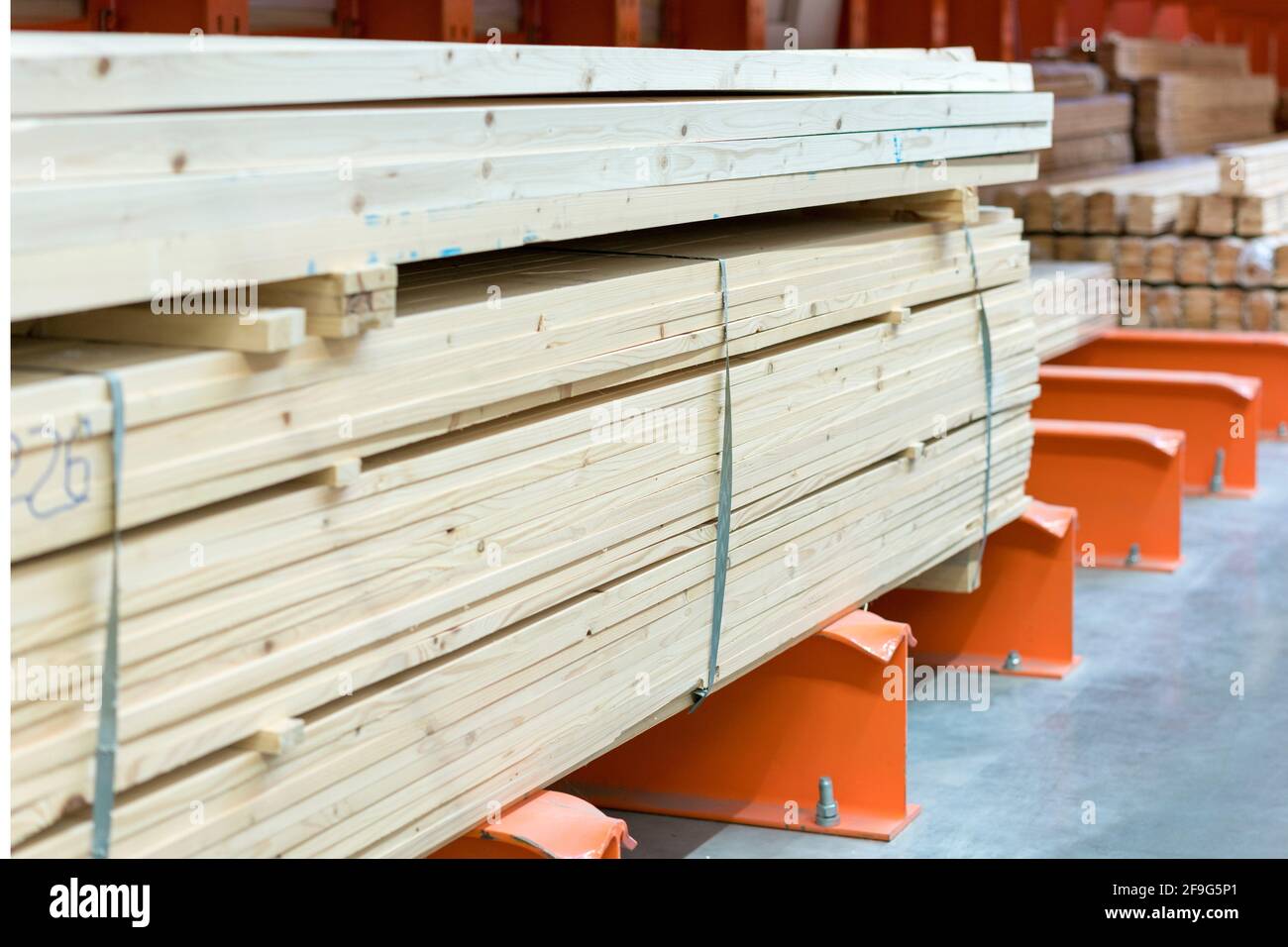 Many wooden planks in hardware store. Stacks of wooden planks at ...