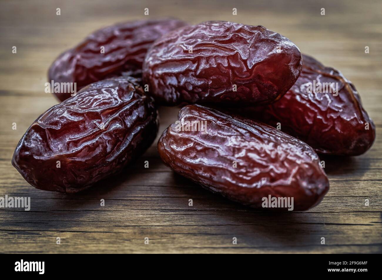 Arabian Dates on natural surface Stock Photo - Alamy