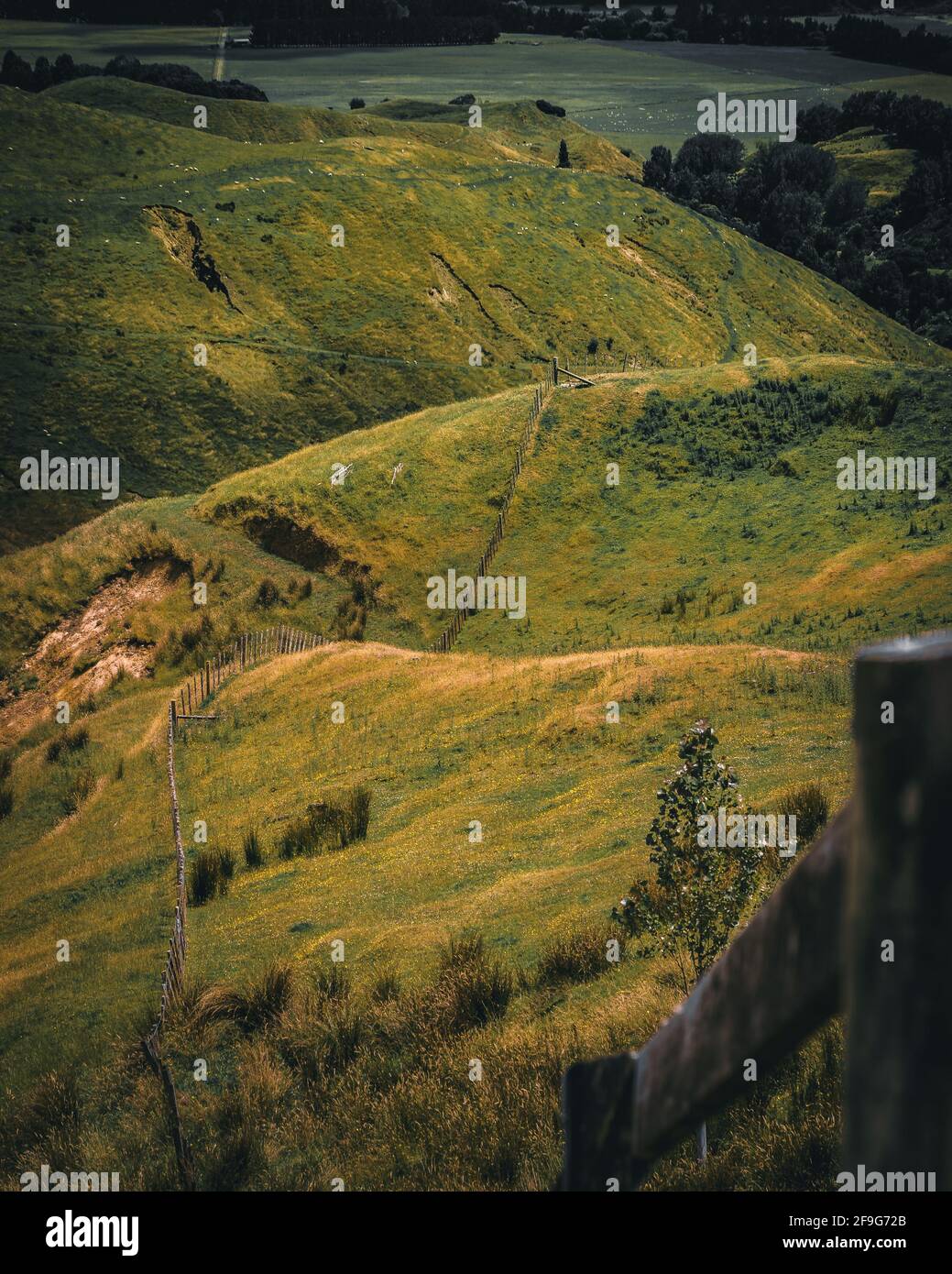 A stunning view of an autumn mountain range with a wooden fence built ...
