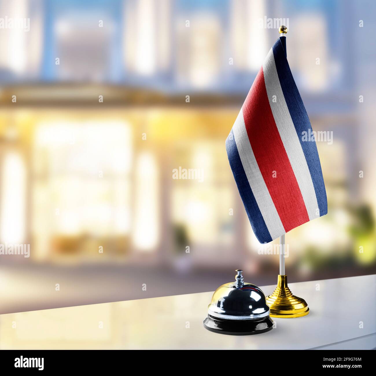 Costa Rica flag on the reception desk in the lobby of the hotel Stock ...