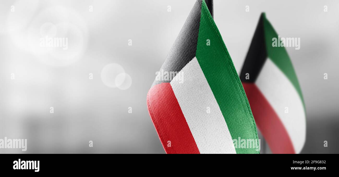 Small national flags of the Kuwait on a light blurry background Stock ...