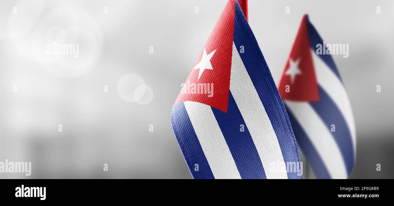 Small national flags of the Cuba on a light blurry background Stock ...