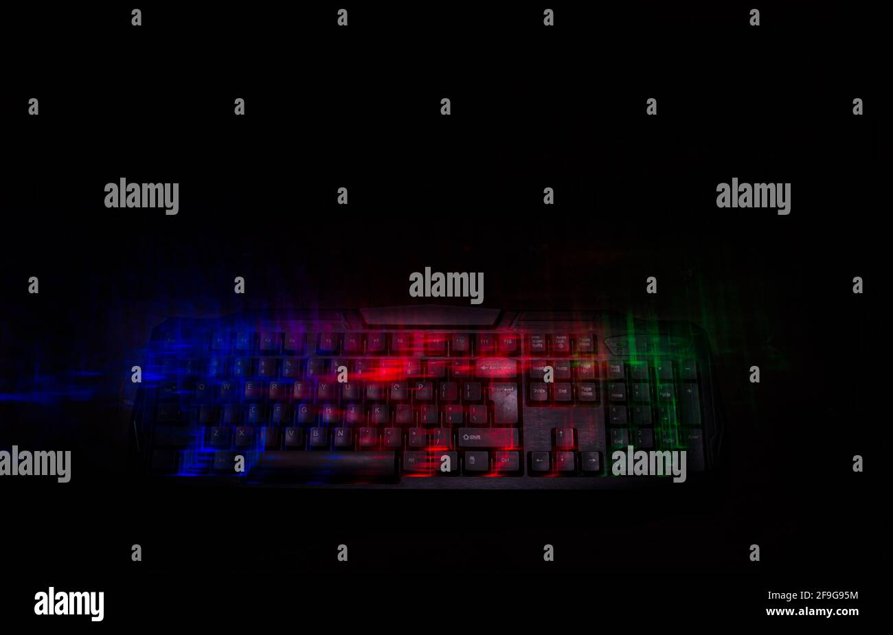 Gaming keyboard with led colors on black background Stock Photo - Alamy