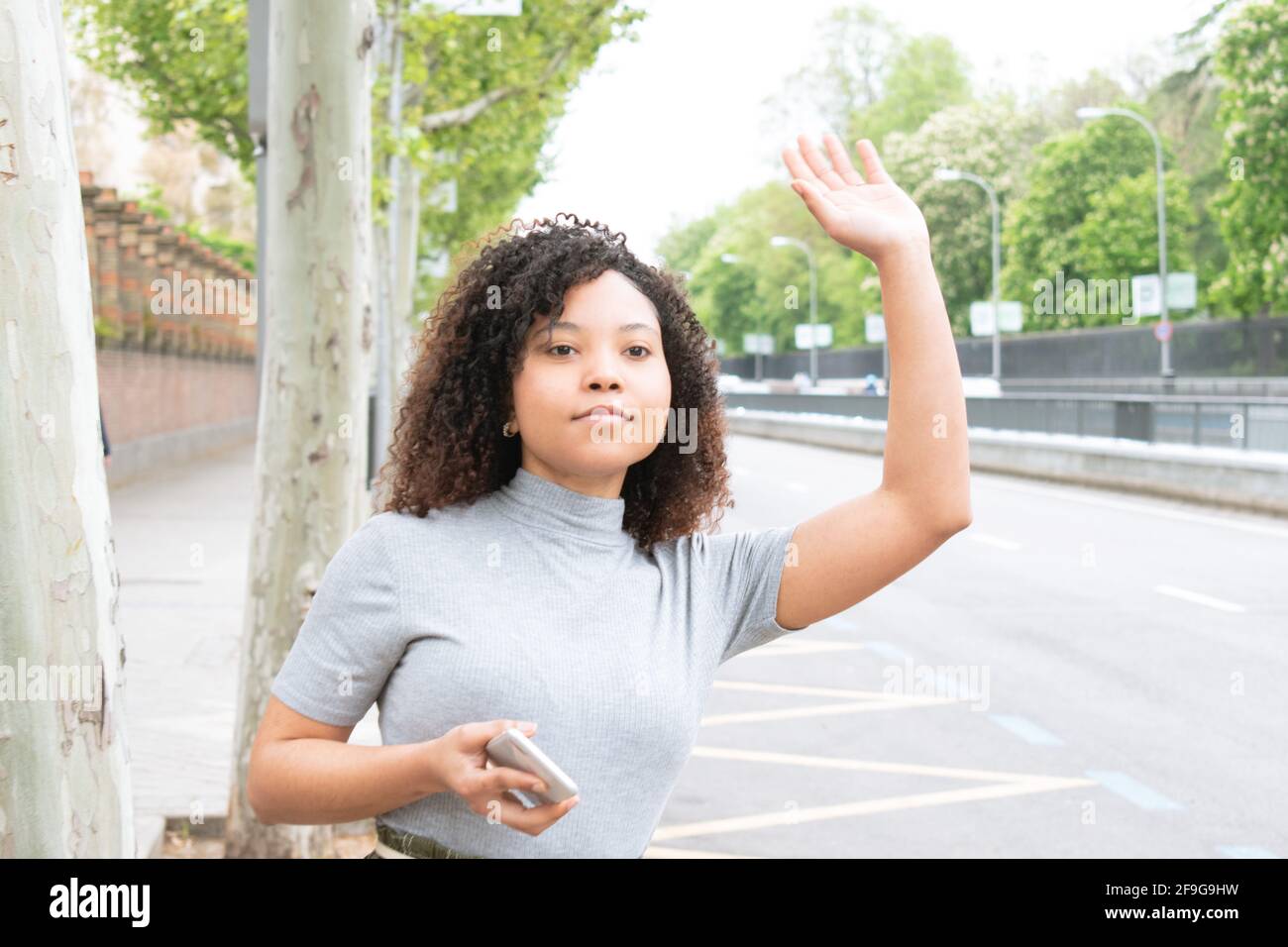 Hailing a cab hi-res stock photography and images - Alamy