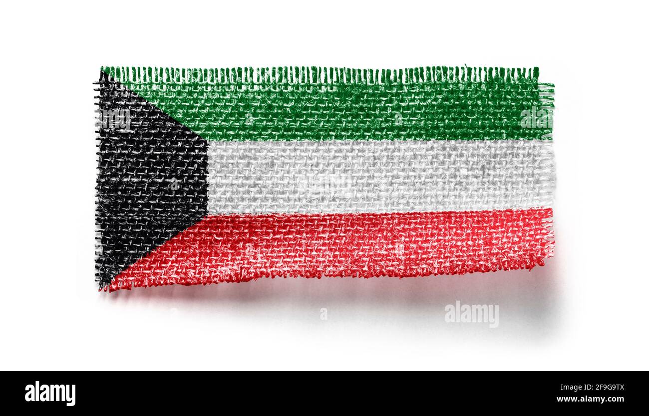 Kuwait flag on a piece of cloth on a white background Stock Photo - Alamy