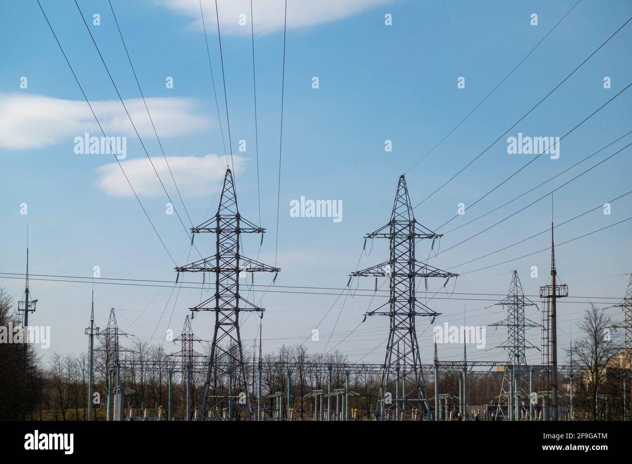 High voltage electric pylon and electrical wire with blue sky ...