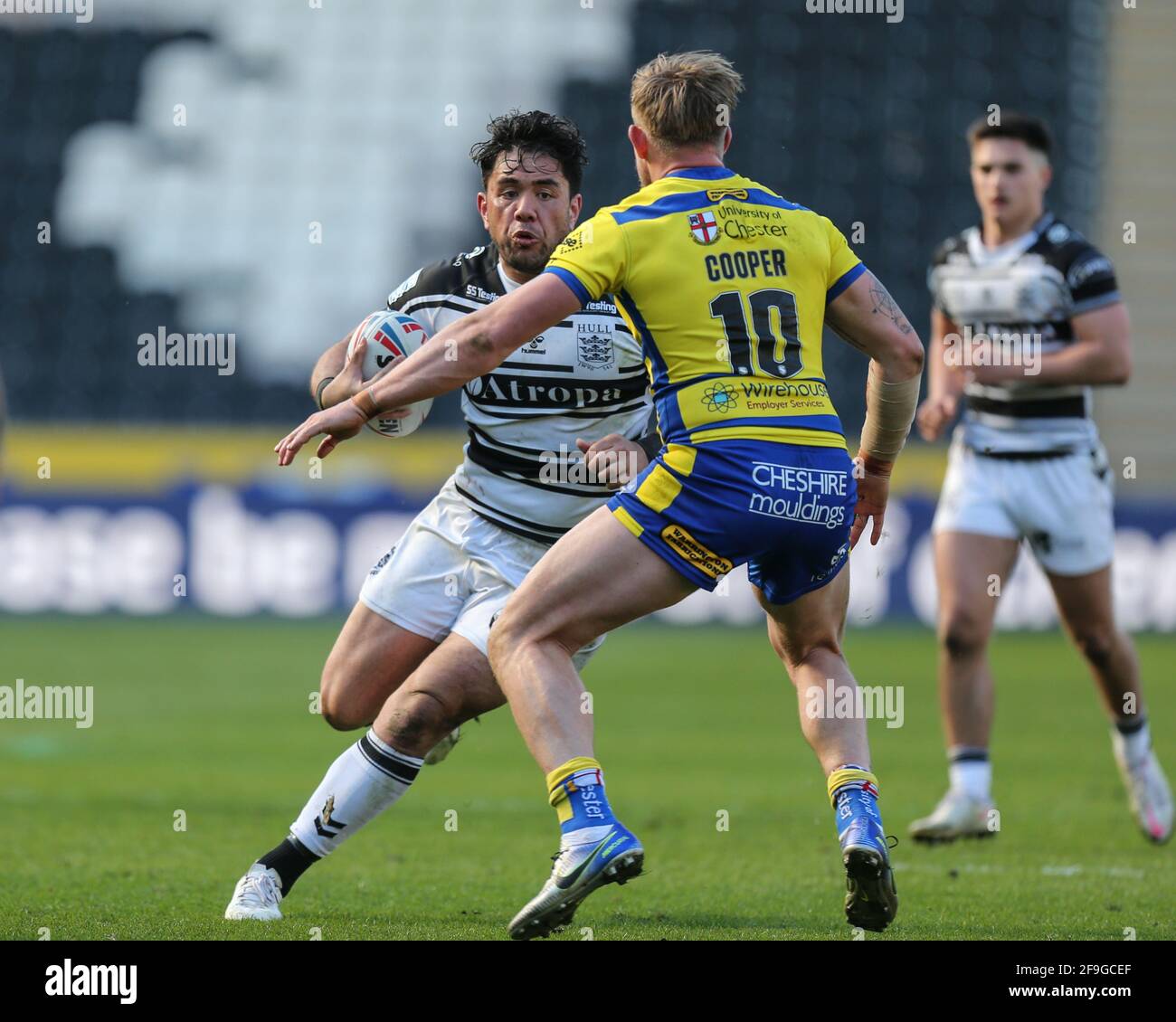 Andre Savelio (11) of Hull FC runs at Mike Cooper (10) of Warrington ...
