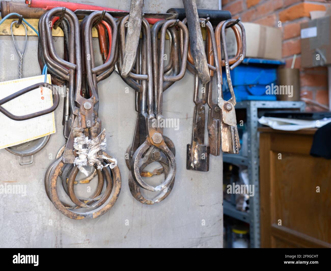 Set of glass cutters and scissors for shaping hot glass on glassblower ...