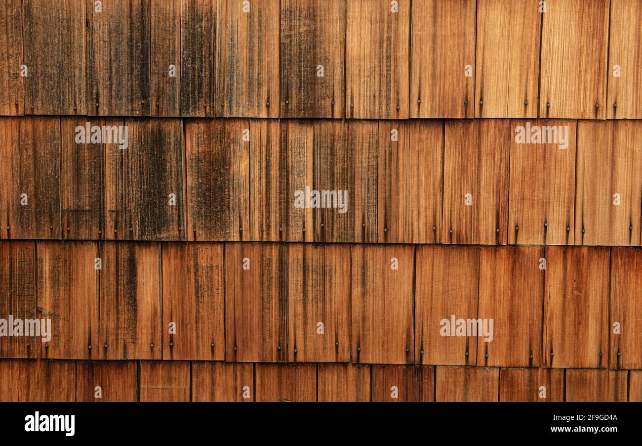 Brown wood shake siding, split shingle, golden brown - texture or ...
