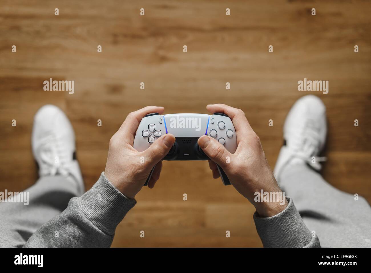 Hand hold new joystick. Gamer play game with gamepad controller. Gaming ...