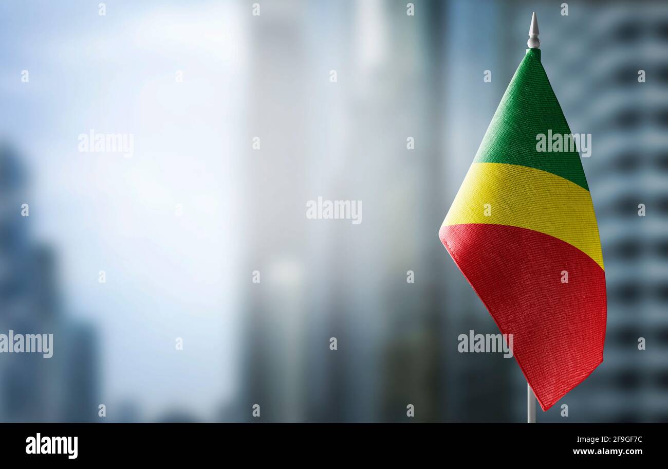 A small flag of Congo on the background of a blurred background Stock ...