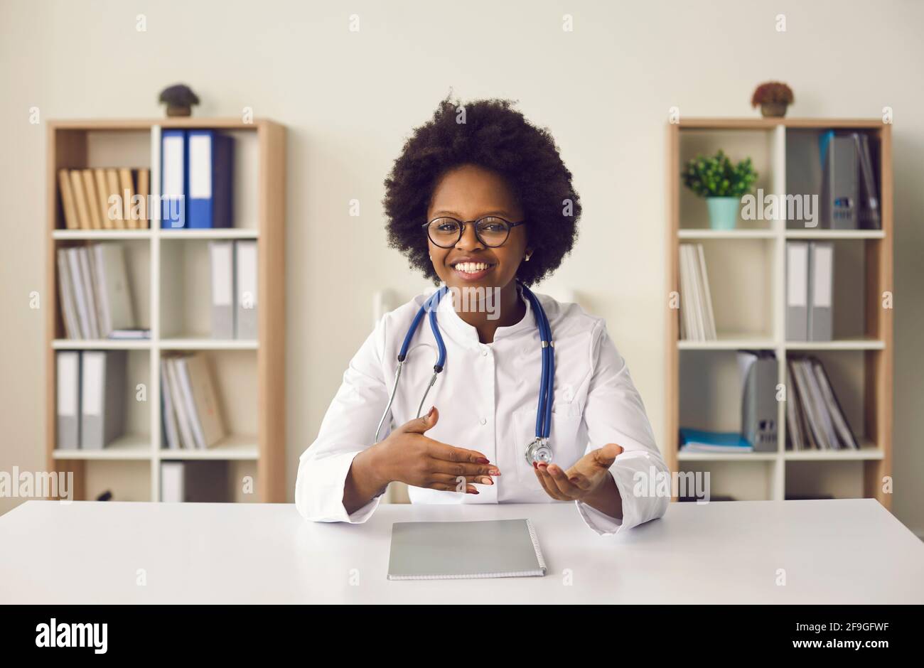 Head shot portrait of african american female doctor talking to camera ...