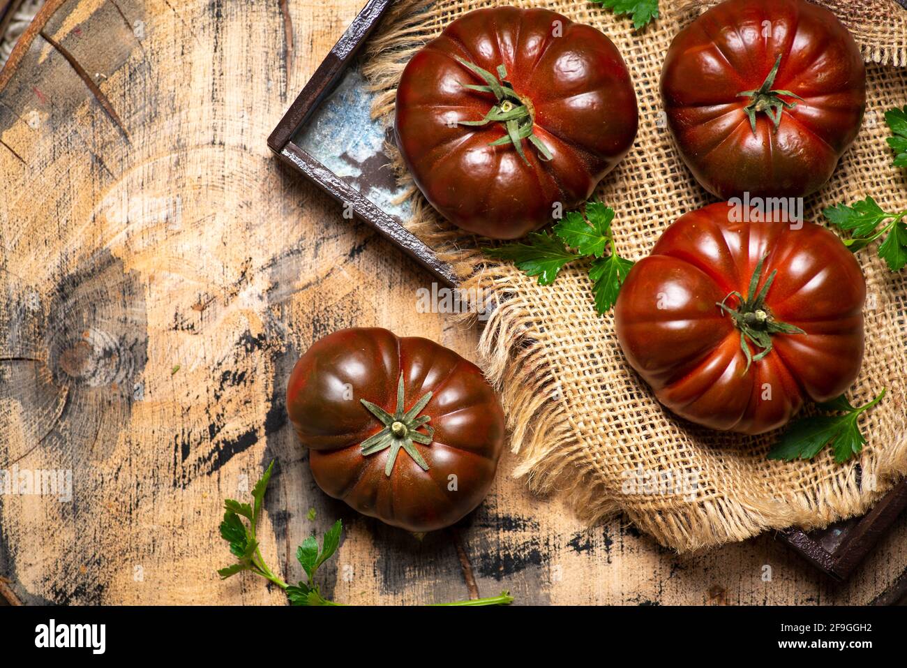 Primora tomato on a rustic wooden table top view Stock Photo - Alamy