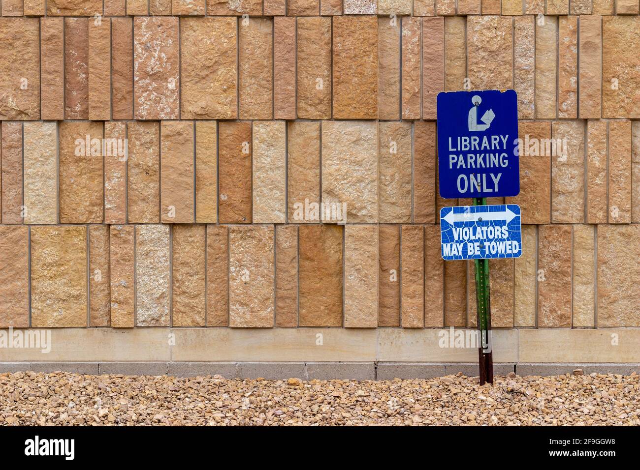 Close up view of a library parking sign in front of an attractive ...