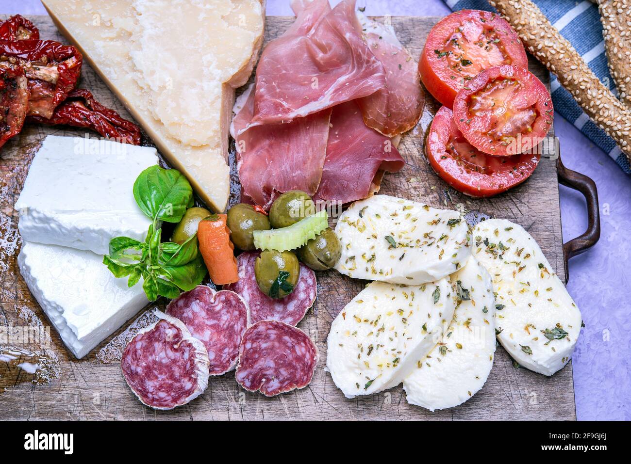 wooden platter of cold cuts appetizer widely used in Italian ...