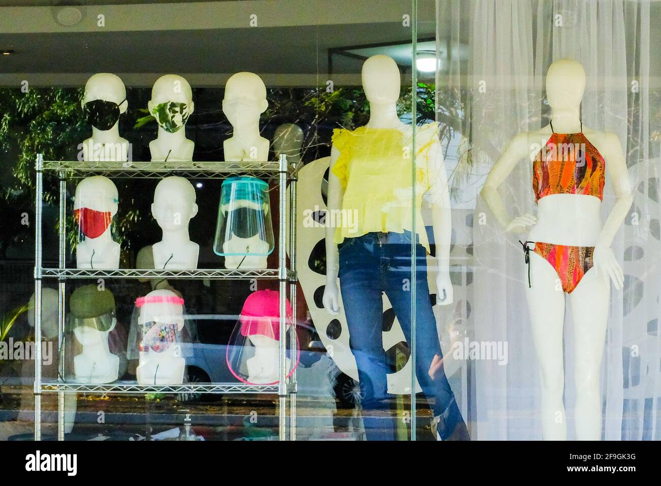 Store with mannequins wearing a face mask, Merida, Mexico Stock Photo ...