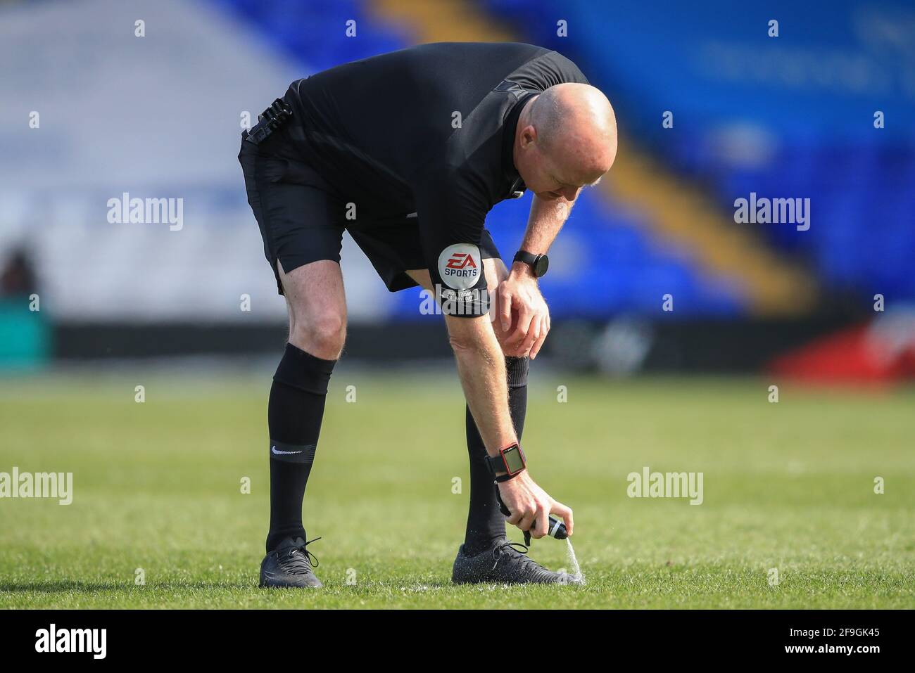 Referee Lee Mason marks the spot for a free-kick with his foam spray ...