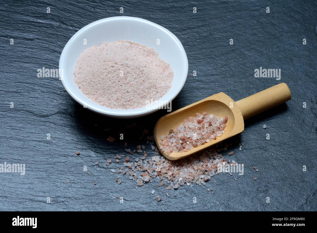 Salt, ground natural salt in bowl and salt crystals in shovel, Germany ...