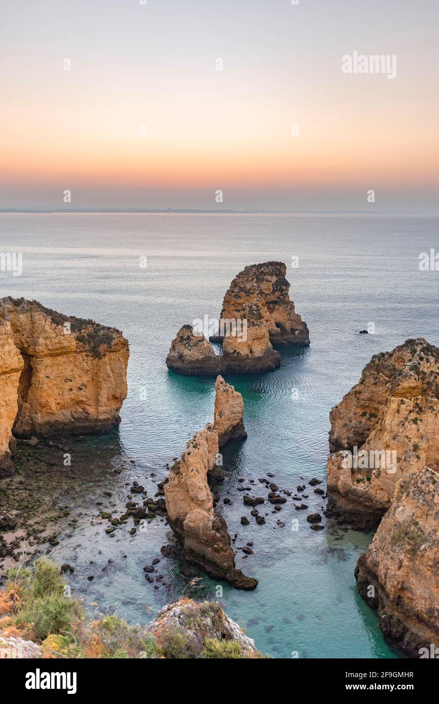Rugged rocky coast with cliffs of sandstone, rock formations in the sea ...