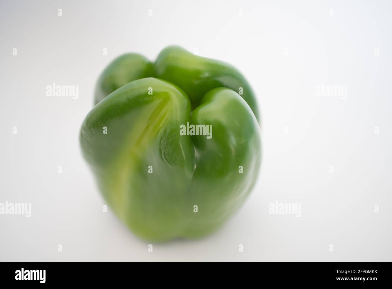 Close up of a fresh green pepper with white background Stock Photo - Alamy