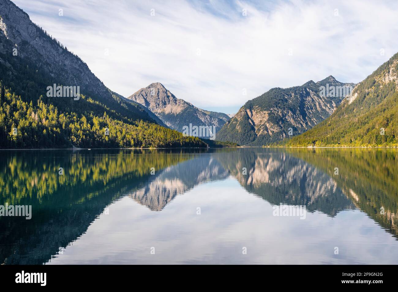 Plansee, mountains reflected in the lake, Ammergau Alps, Reutte, Tyrol ...