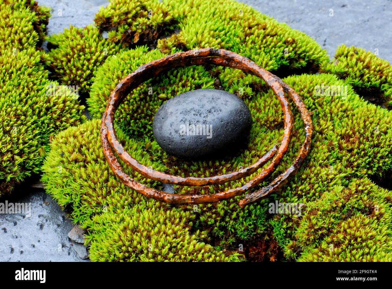 Stone and rusty metal ring Stock Photo - Alamy