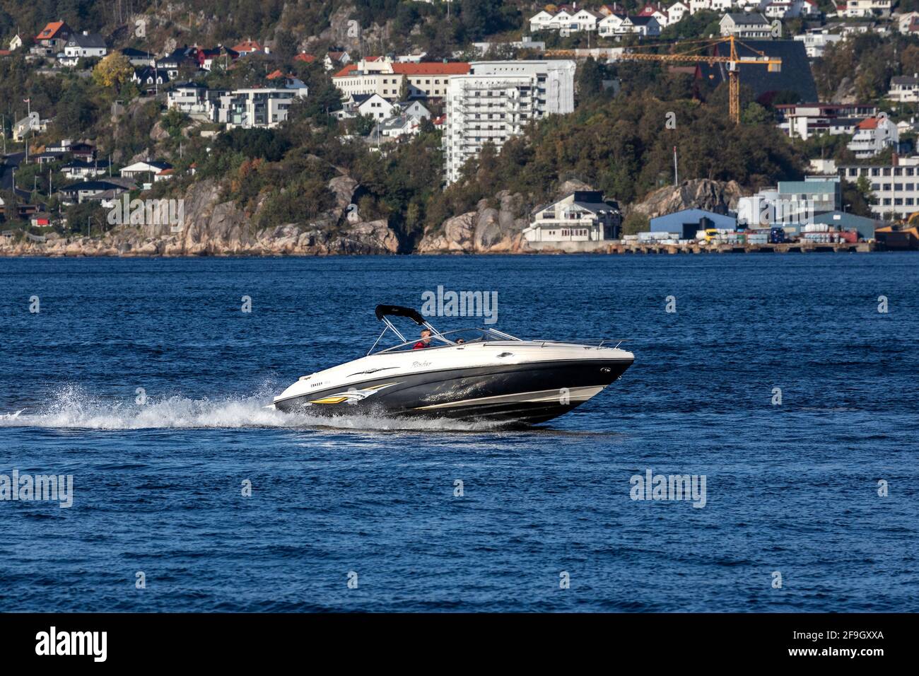 Pleasure craft, a Rinker boat at Byfjorden, outside port of Bergen ...