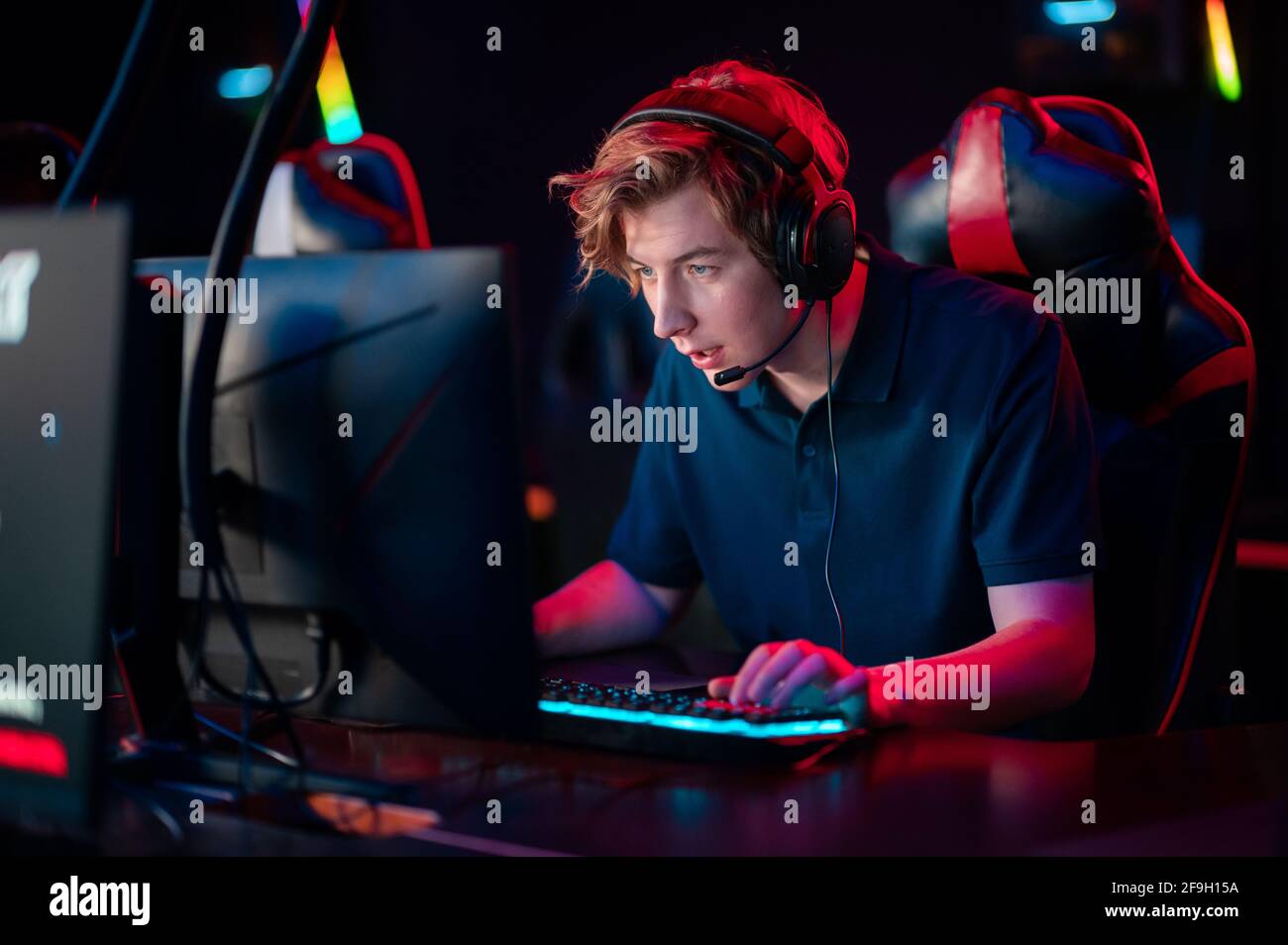 Game of a young guy wearing headphones in a video game in a computer ...