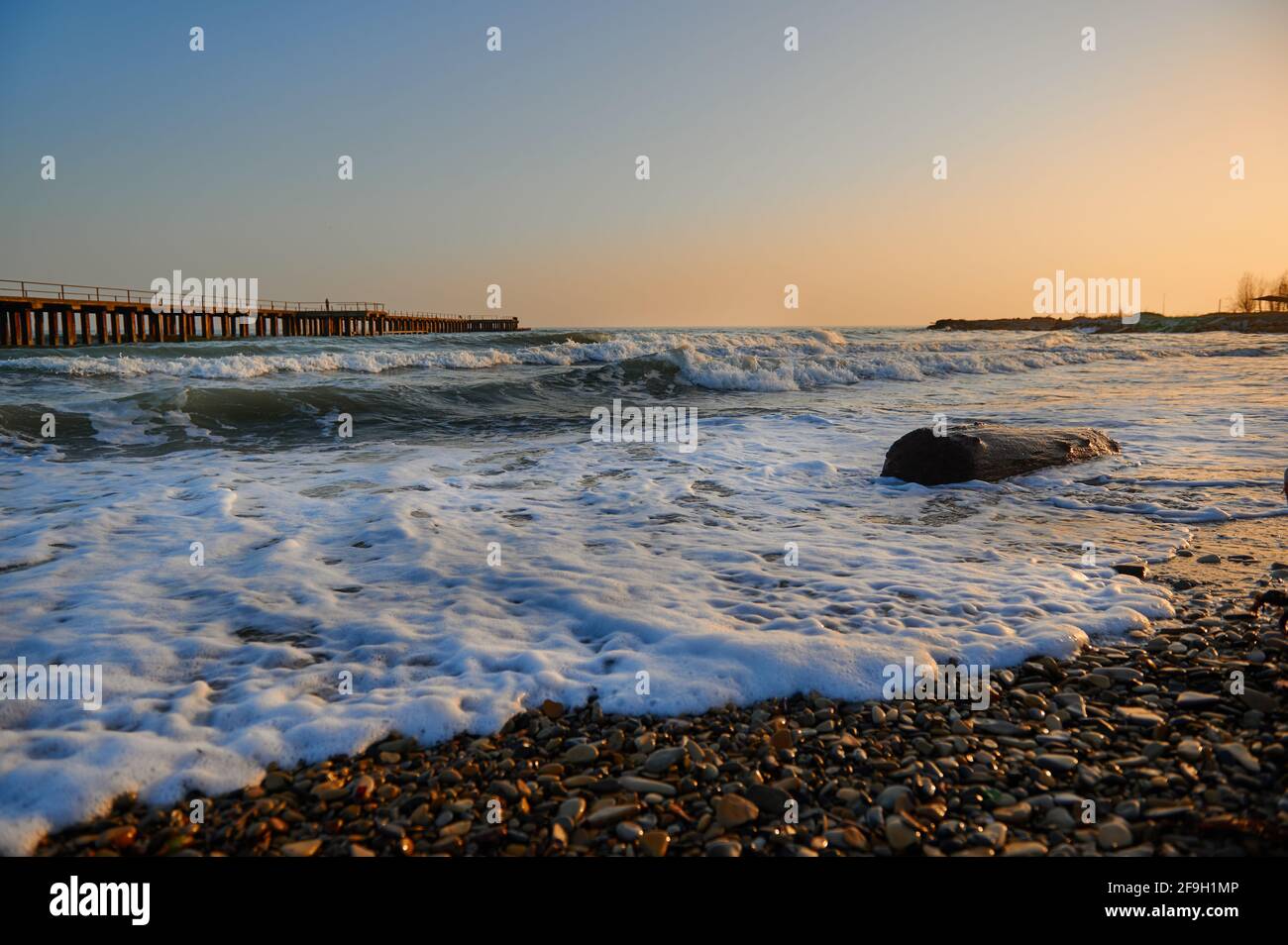 pier receding into the distance view from the coast of the black sea at ...