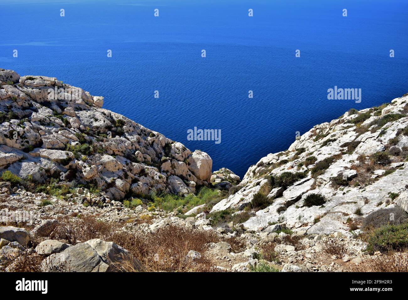 The V-shaped valley along the coastal cliffs of the Maltese Islands ...