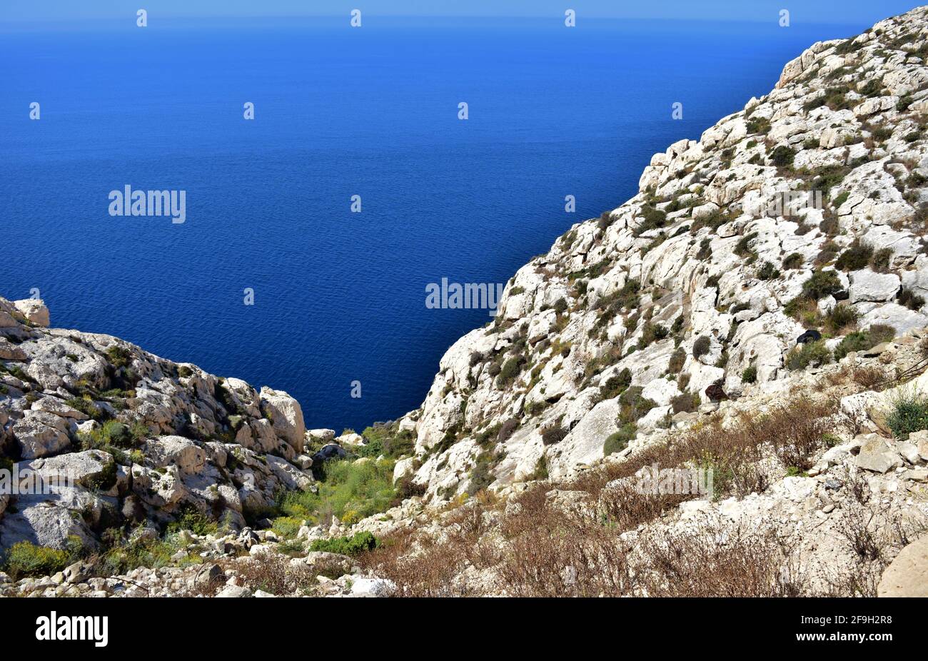 The V-shaped valley along the coastal cliffs of the Maltese Islands ...