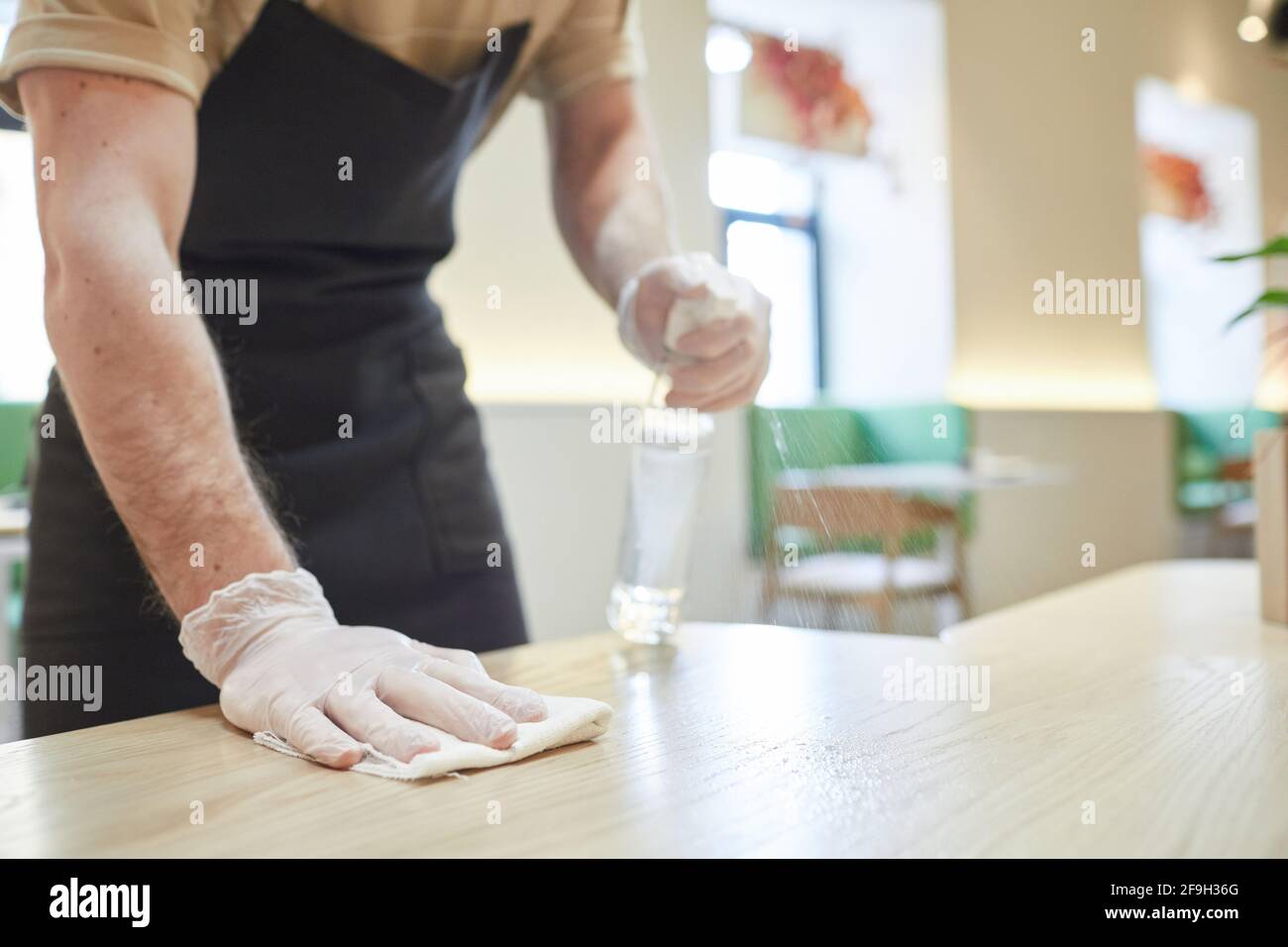 Person cleaning tables hi-res stock photography and images - Alamy