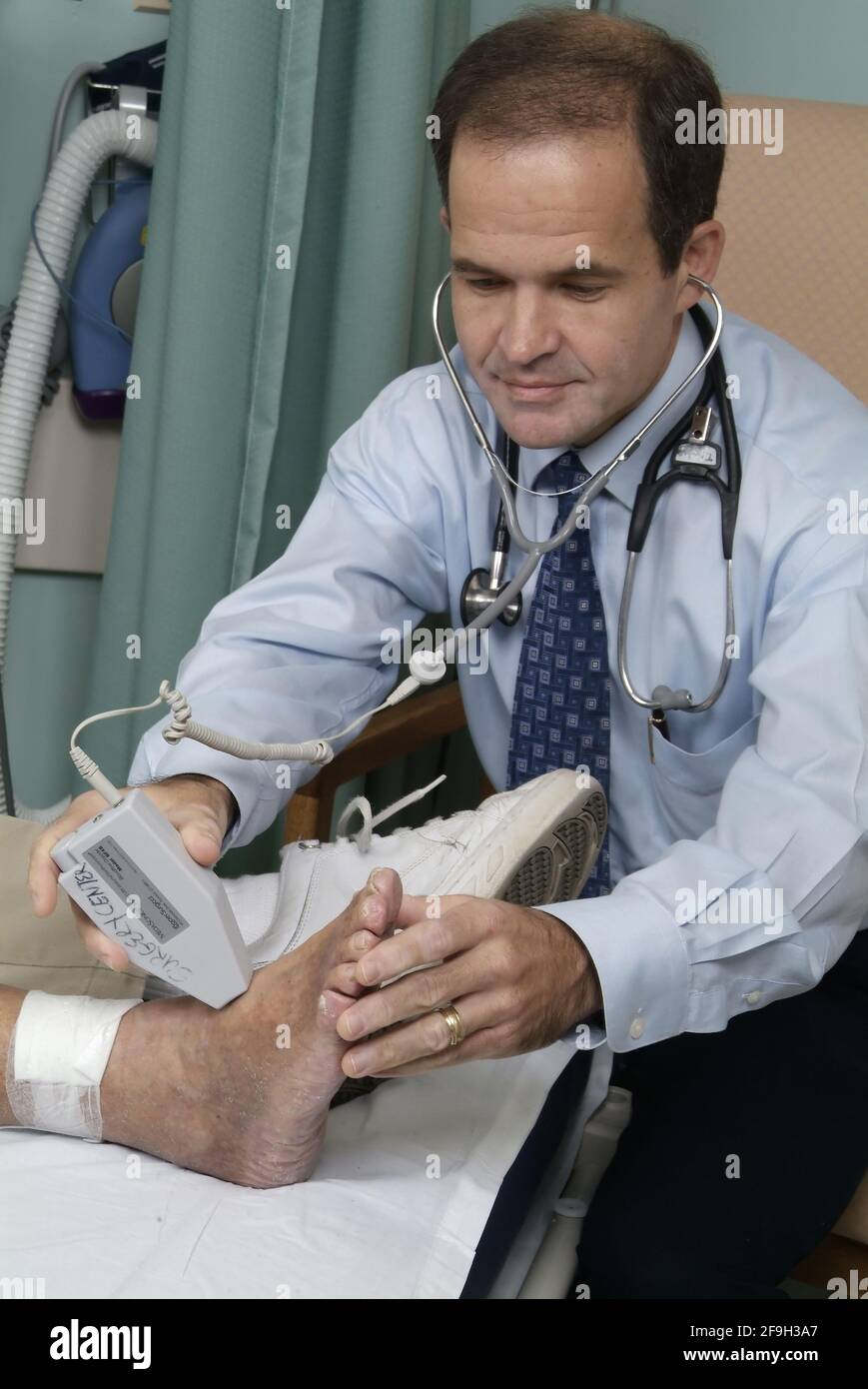 ST. CHARLES, UNITED STATES - Oct 08, 2007: A doctor examining a patient ...