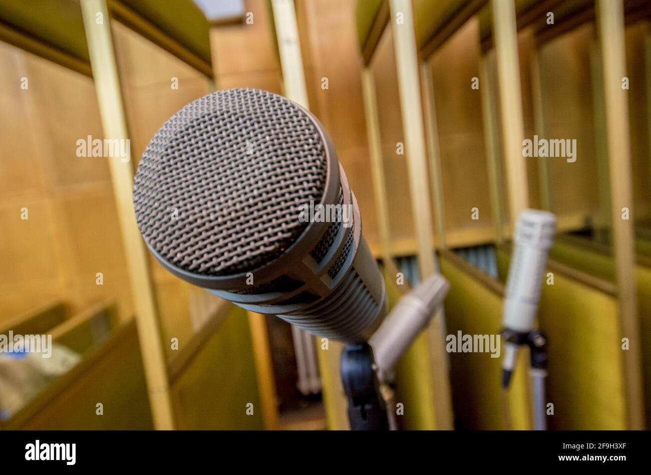 A closeup of a microphone on a stand in a sound booth Stock Photo - Alamy