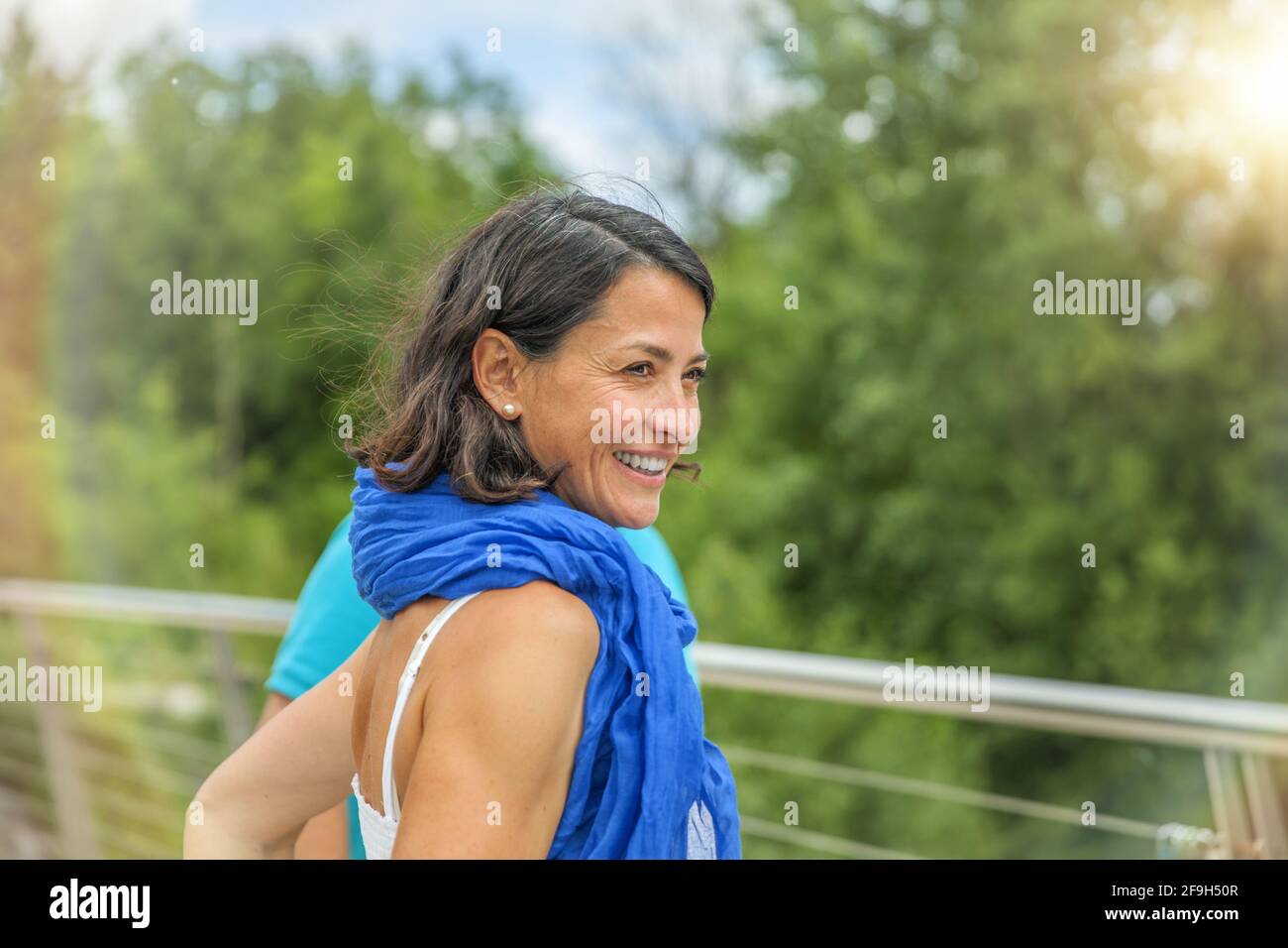 A smiling Caucasian female in a park on a sunny day Stock Photo - Alamy