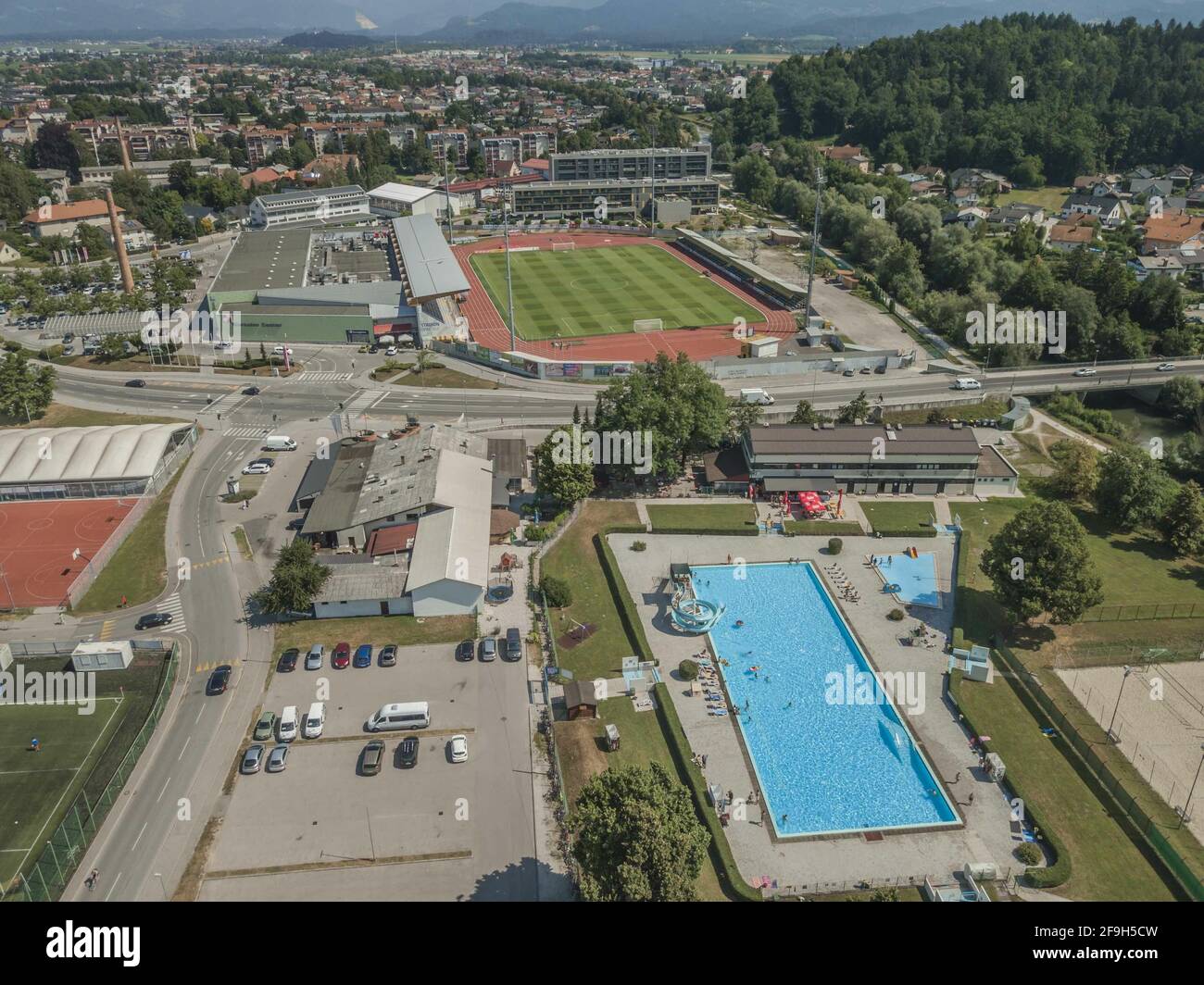 Resort area with a football pitch and a swimming pool surrounded by ...